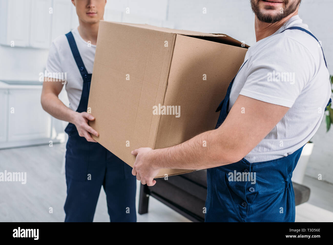 Two Men Moving Box High Resolution Stock Photography and Images - Alamy