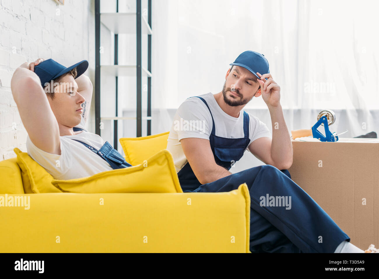 Two men moving couch apartment hi-res stock photography and images - Alamy