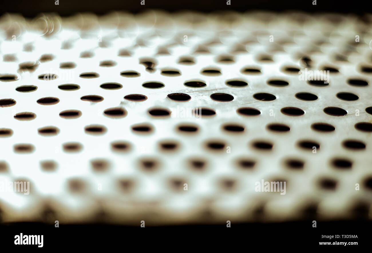 Perforated aluminium sheet of metal texture. Surface with depth of ...