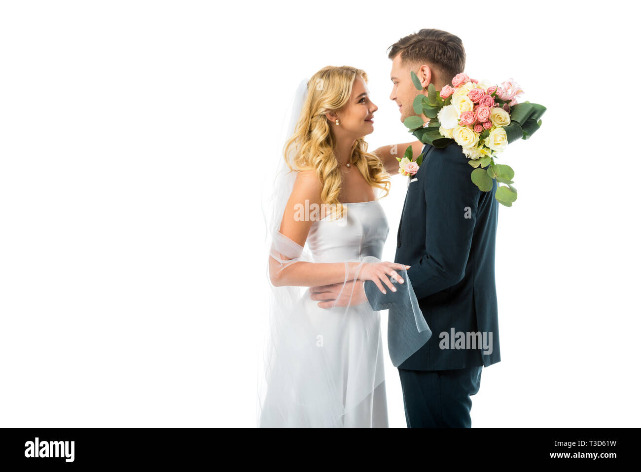 beautiful bride in wedding dress, and handsome groom in elegant black ...