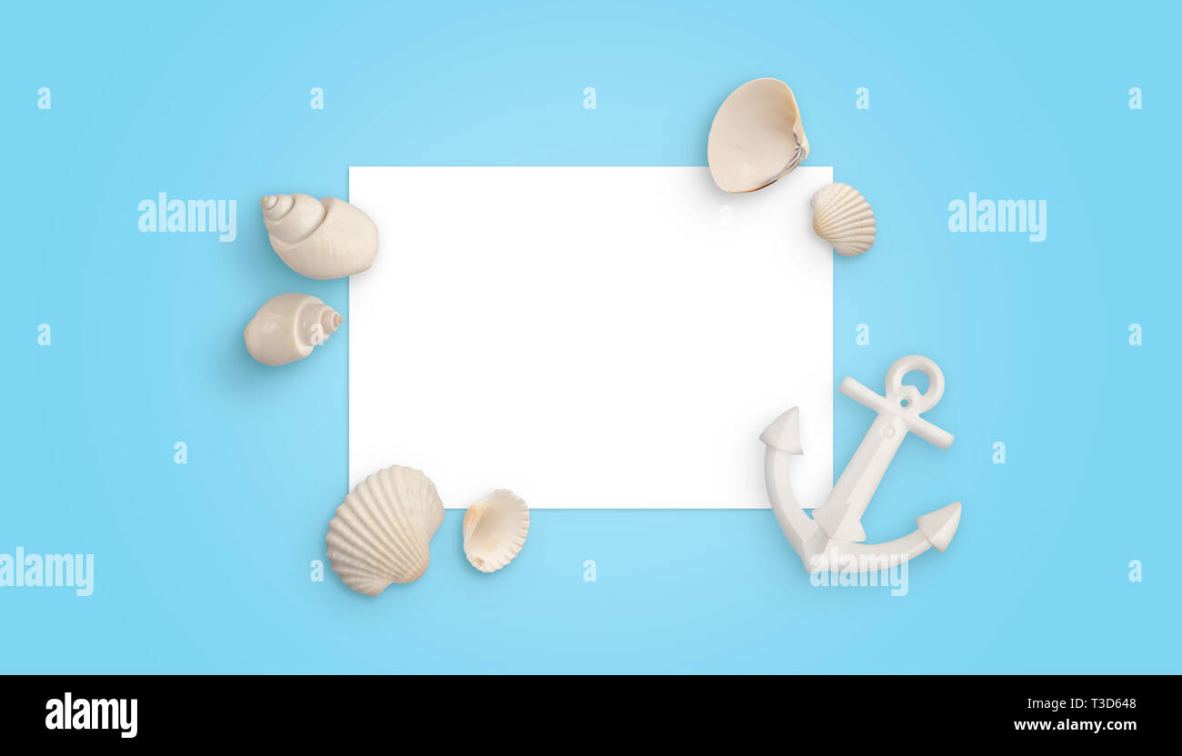 White blank paper surrounded with sea shells and white boat anchor ...