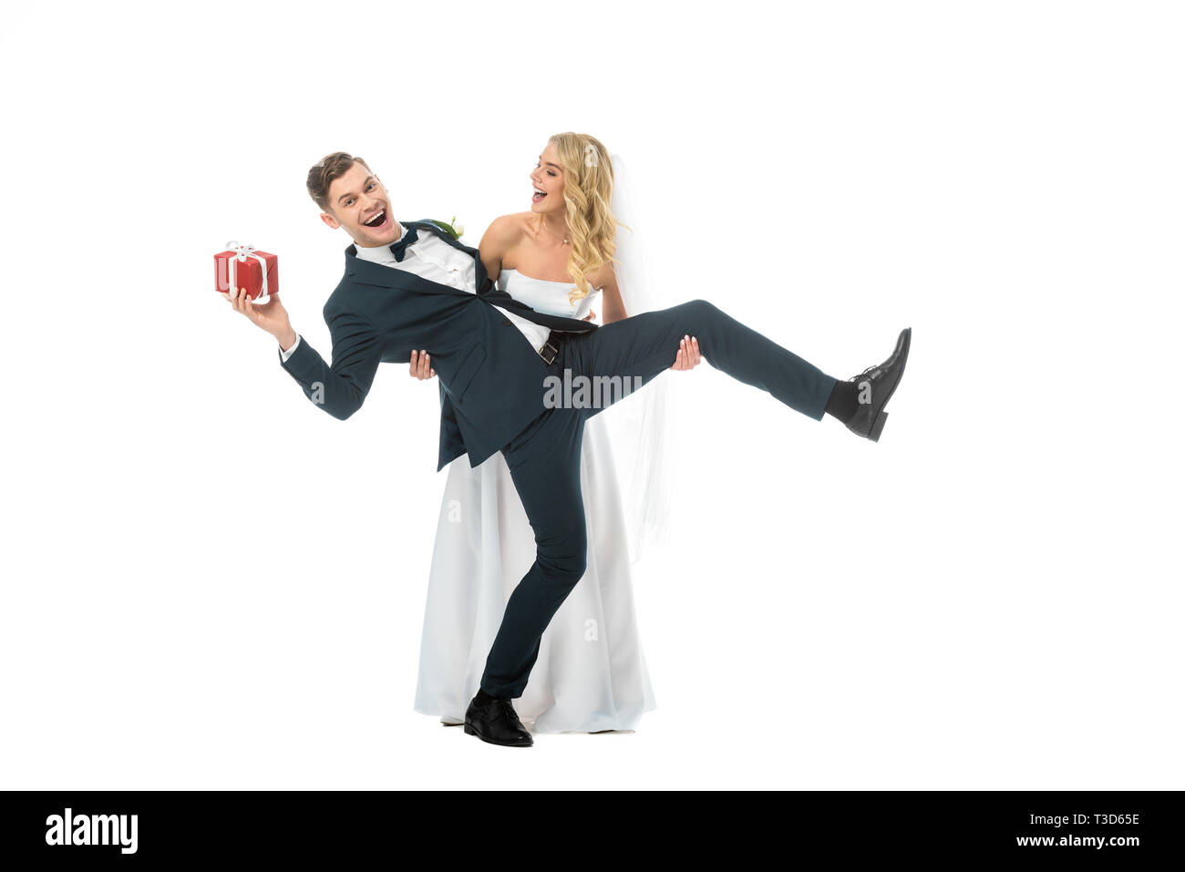 excited bride and groom with gift box having fun isolated on white ...