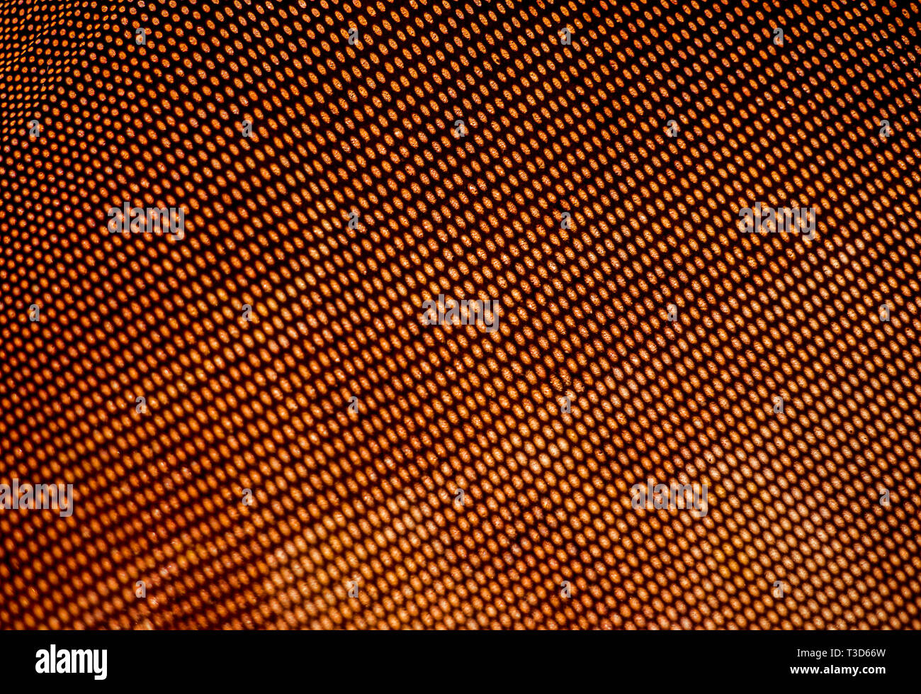 Shedow of perforated net on rusty metal sheet. Surface with depth of ...
