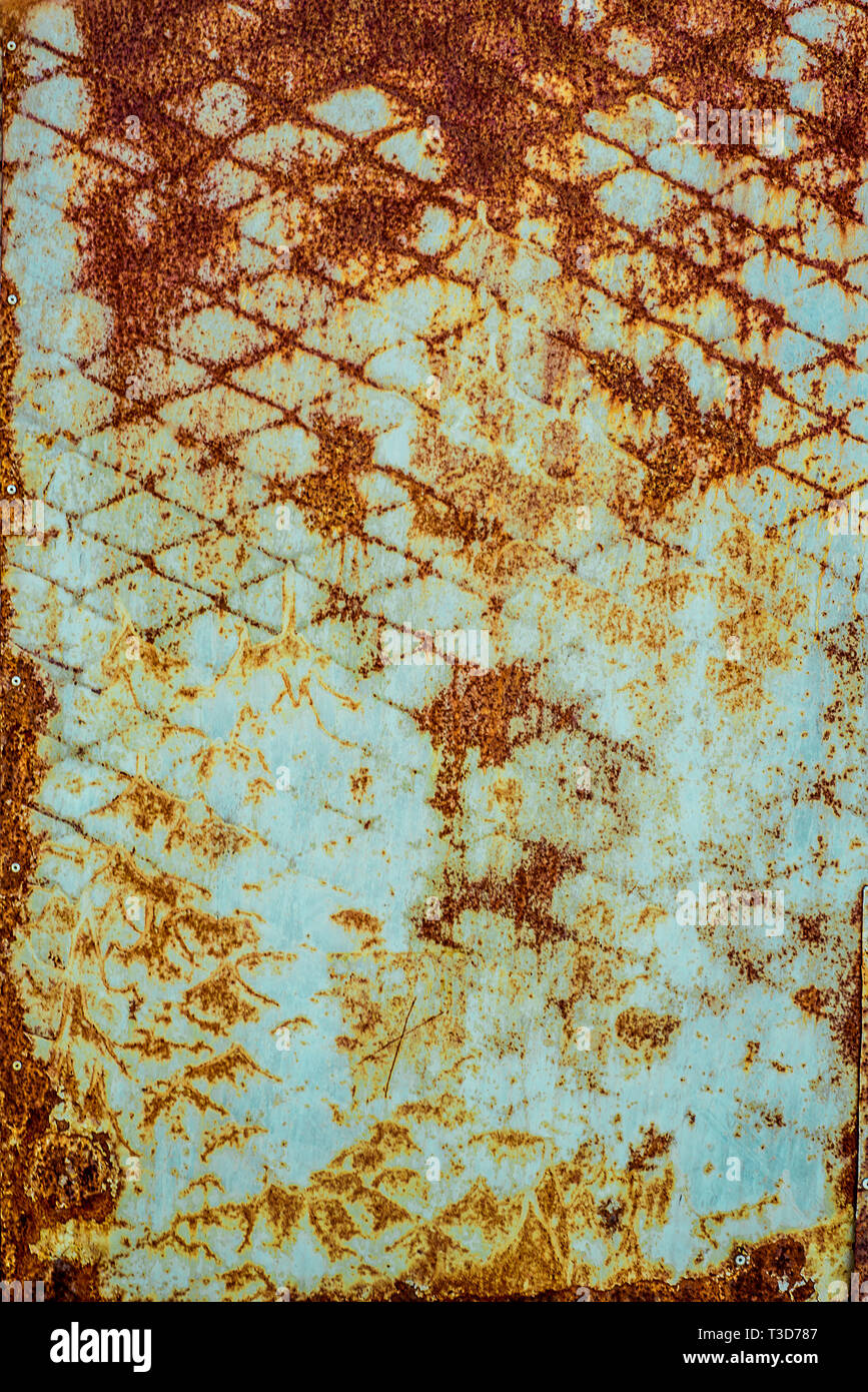 Texture of old rusty metal, painted white which became orange from rust ...