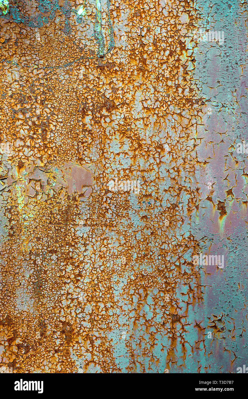 Texture of old rusty metal, painted white which becames orange from ...