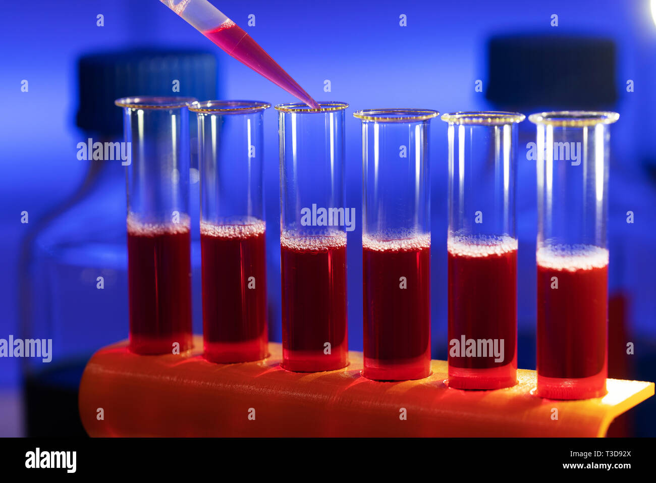 Test tube in rack and pipette media dispenser Stock Photo - Alamy
