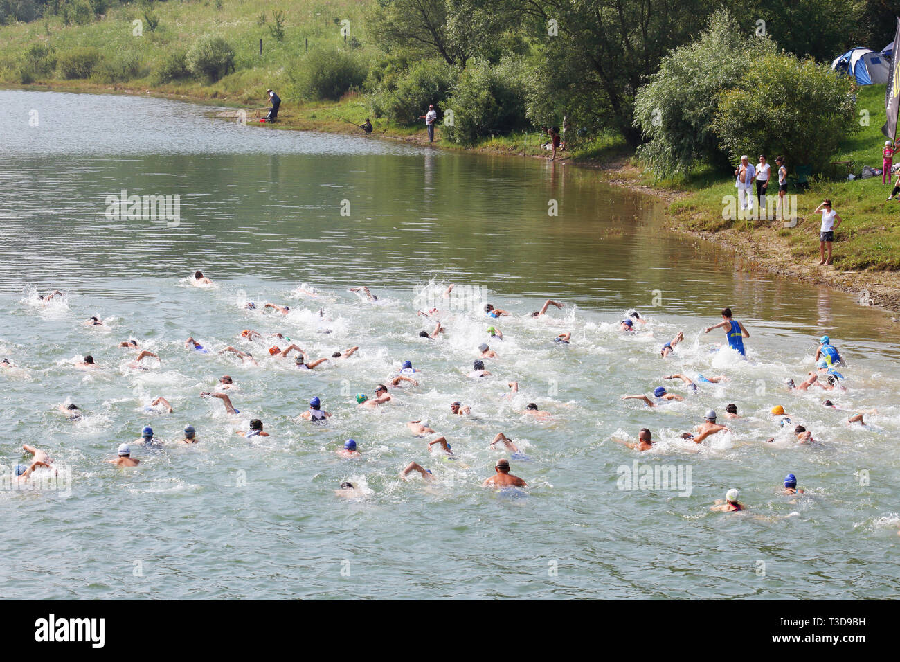 Group of swimmers at triathlon competition at Lake Bezid, near Tirgu ...
