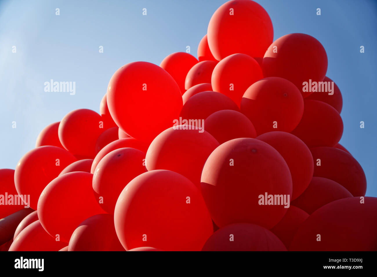 Red helium air balloon with calm blue cloudy sky on background. Peace ...