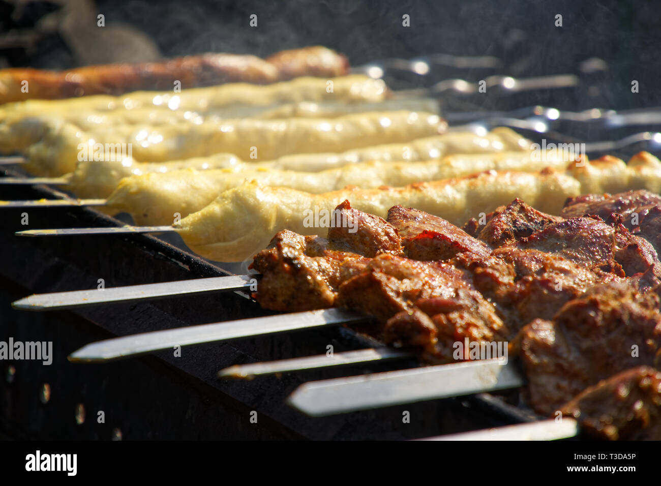 Barbecue meat on grill, traditional street food Stock Photo - Alamy