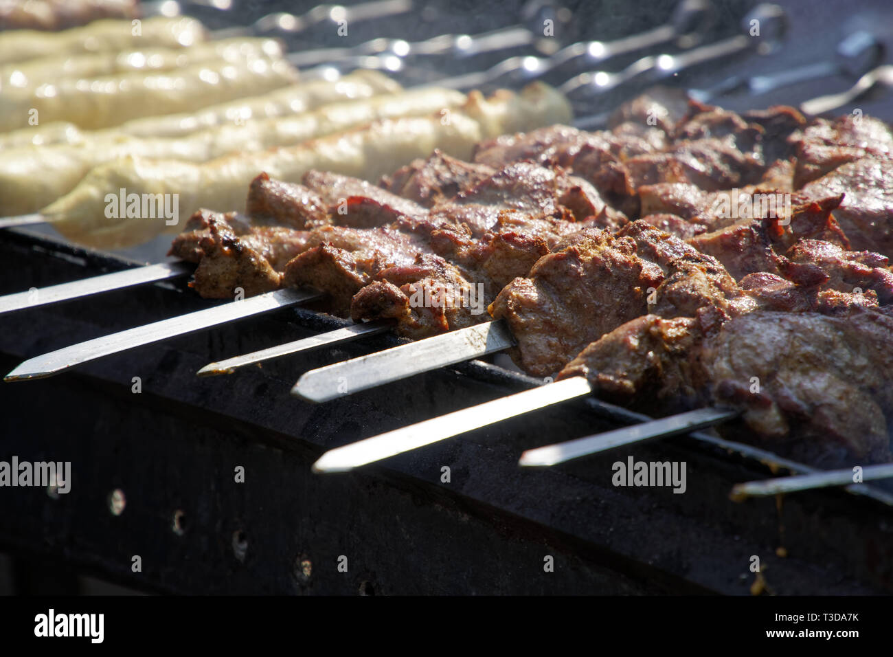 Barbecue meat on grill, traditional street food Stock Photo - Alamy