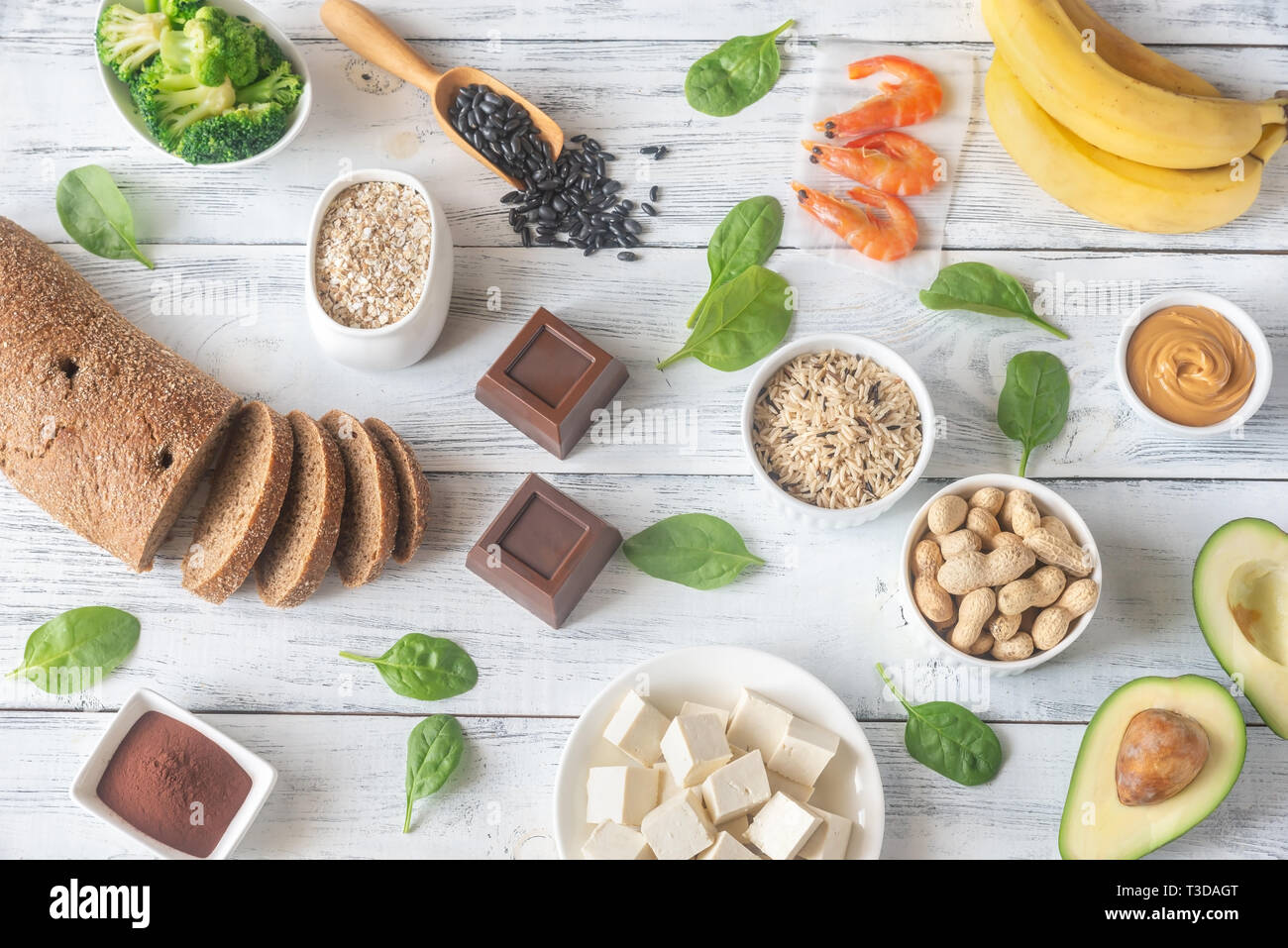 Assortment of magnesium-rich foods on the wooden background Stock Photo ...