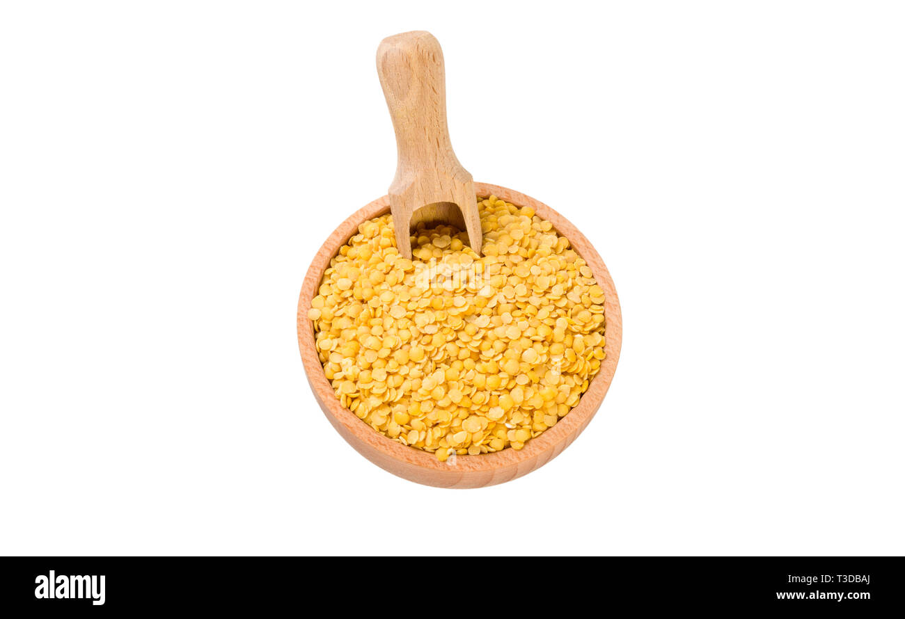 yellow lentils in wooden bowl and scoop isolated on white background ...