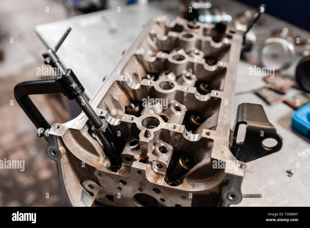 the mechanic opened the locking valve mechanism. Disassemble engine ...