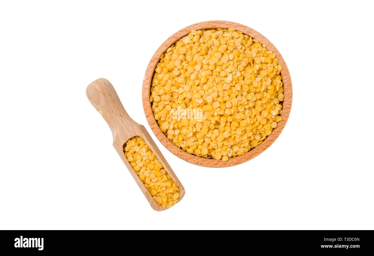yellow lentils in wooden bowl and scoop isolated on white background ...