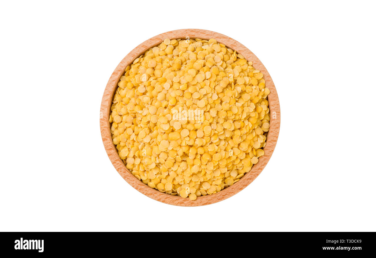 yellow lentils in wooden bowl isolated on white background. nutrition ...