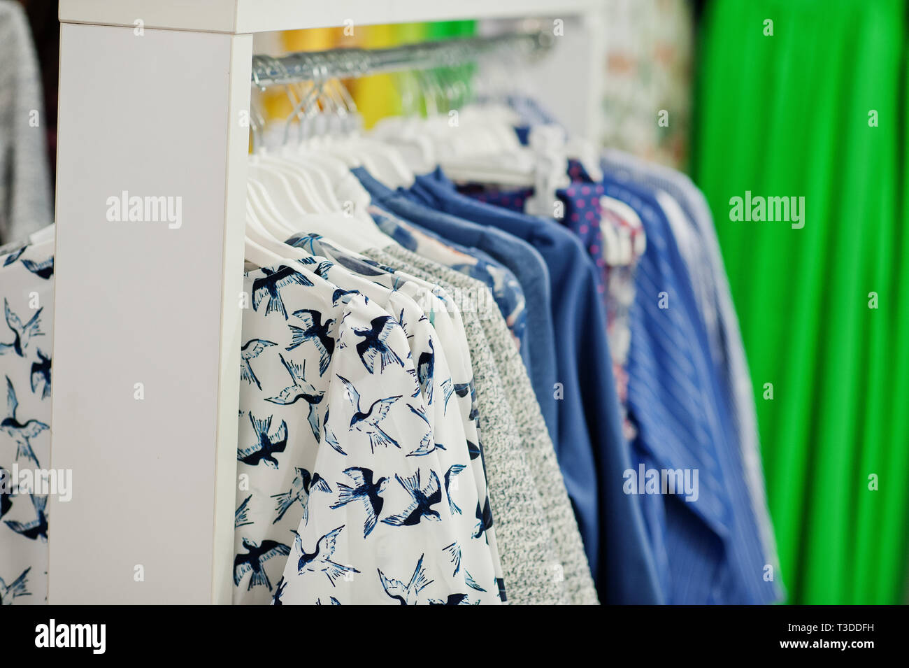 Female colorful clothing set of on the racks in clothing store brand ...