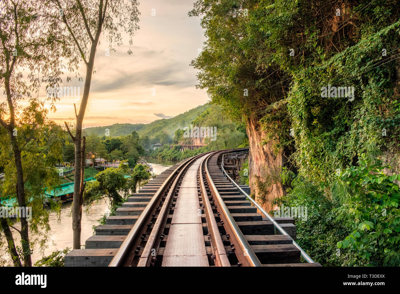 Ancient wooden railway historic of world war II at sunset, Tham Krasae ...