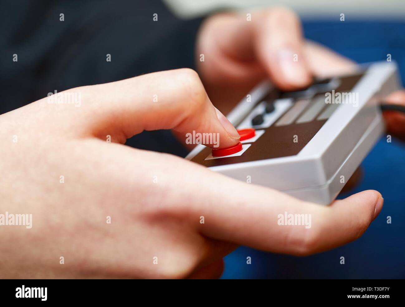 Playing an old gaming console Stock Photo - Alamy