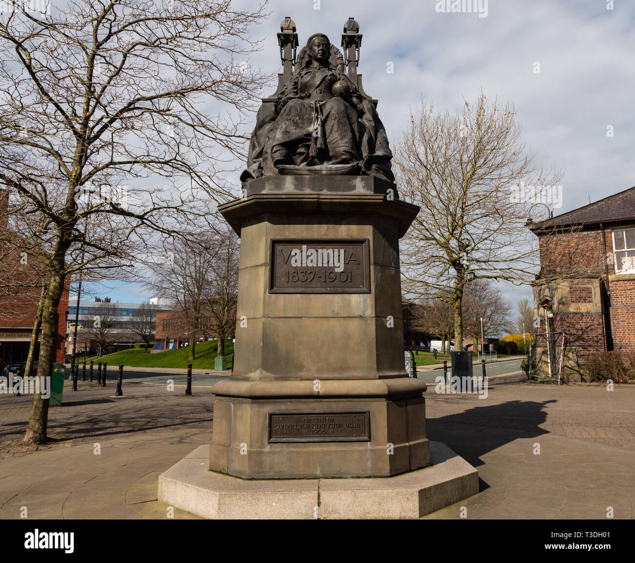 Statue of Queen Victoria on a throne St Helens Merseyside England March ...