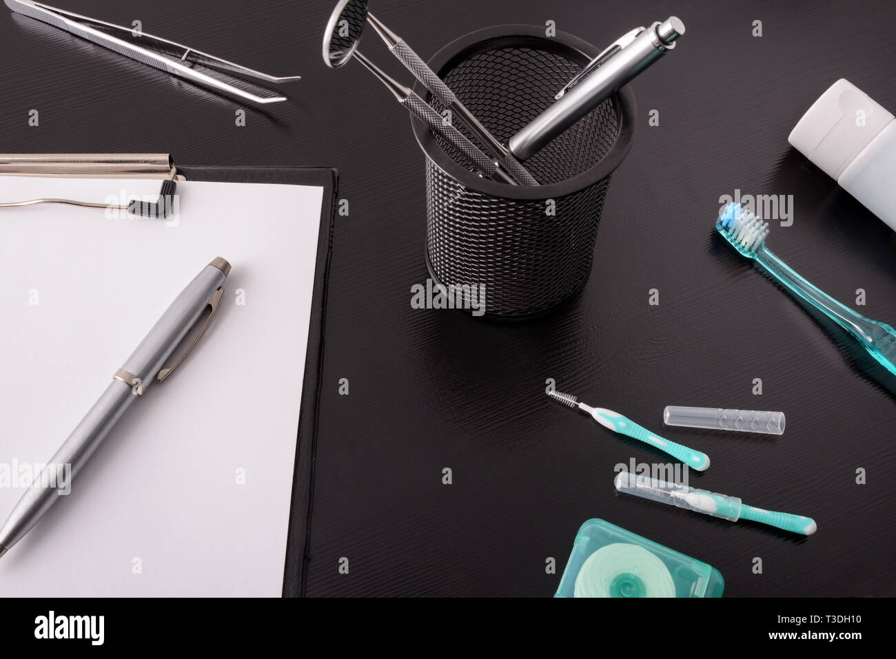 Black dentist table with tools. Top elevated view. Horizontal ...