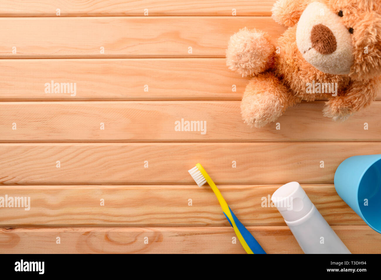 Children's oral hygiene with cleaning elements on wooden table and ...