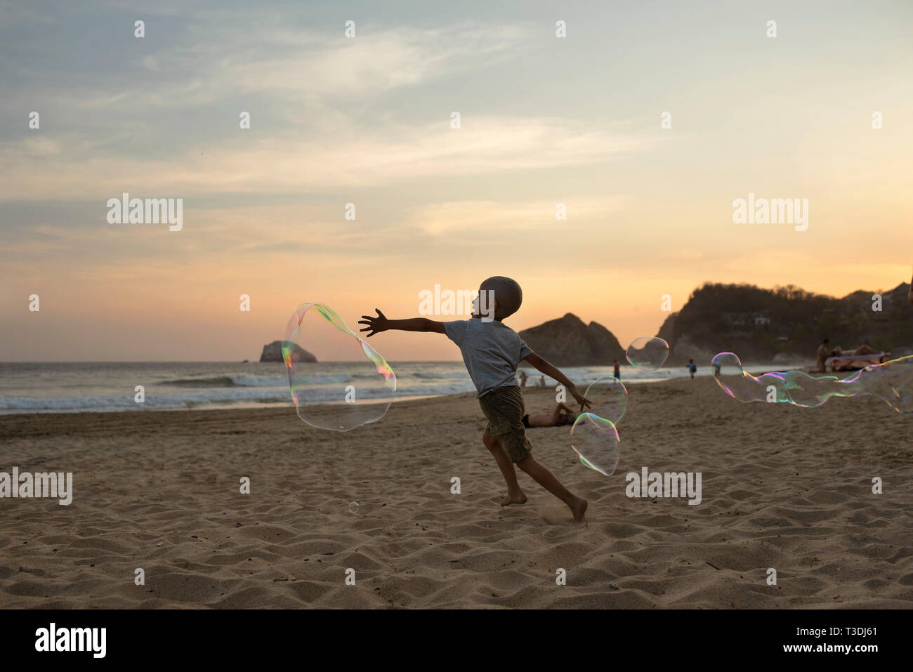 Boy chasing bubbles mexico hi-res stock photography and images - Alamy