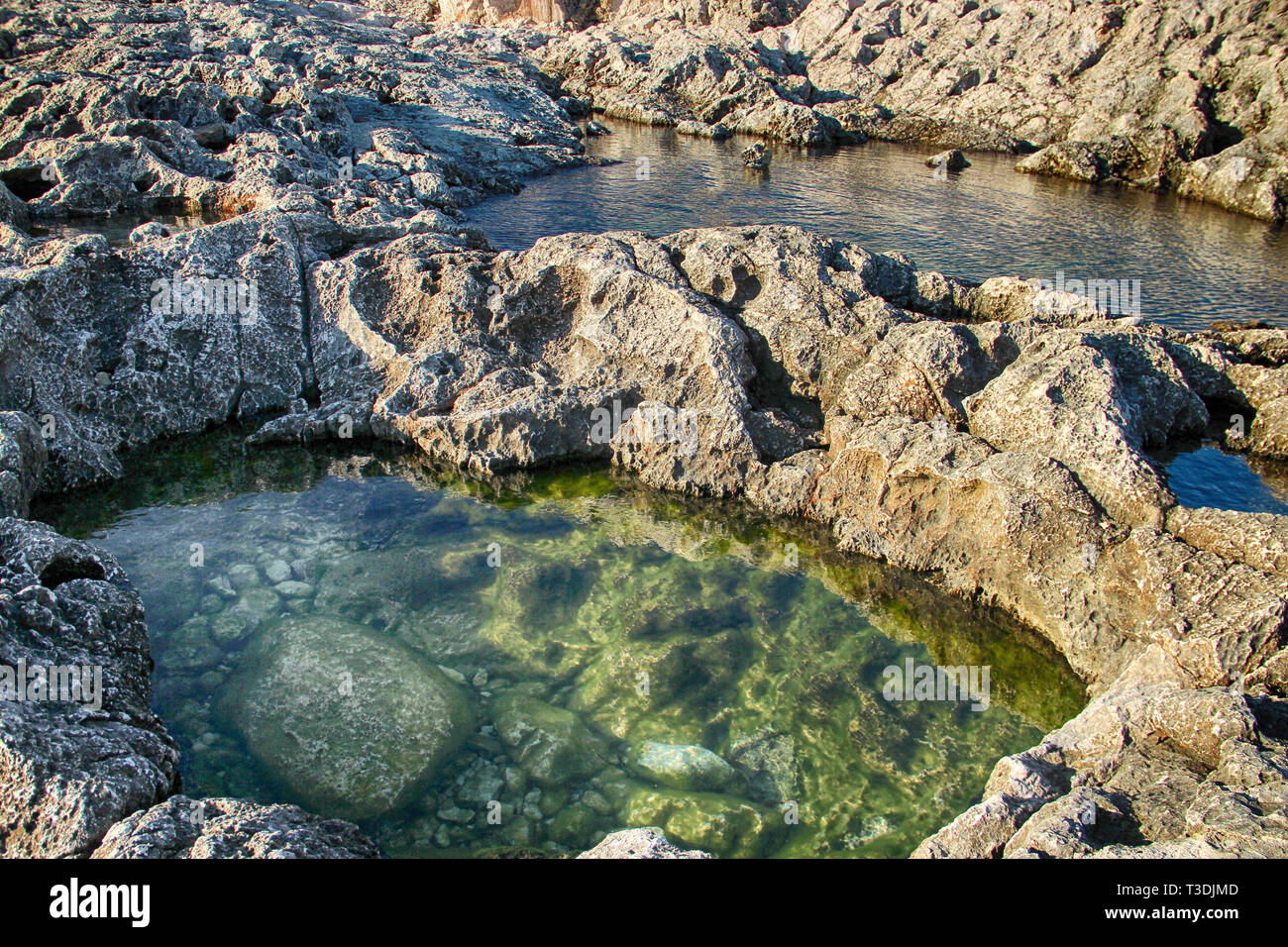 Natural swimming pool in sea and stone cliff Stock Photo - Alamy