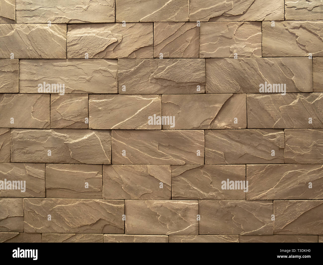 brown rough stone block wall pattern for background Stock Photo - Alamy