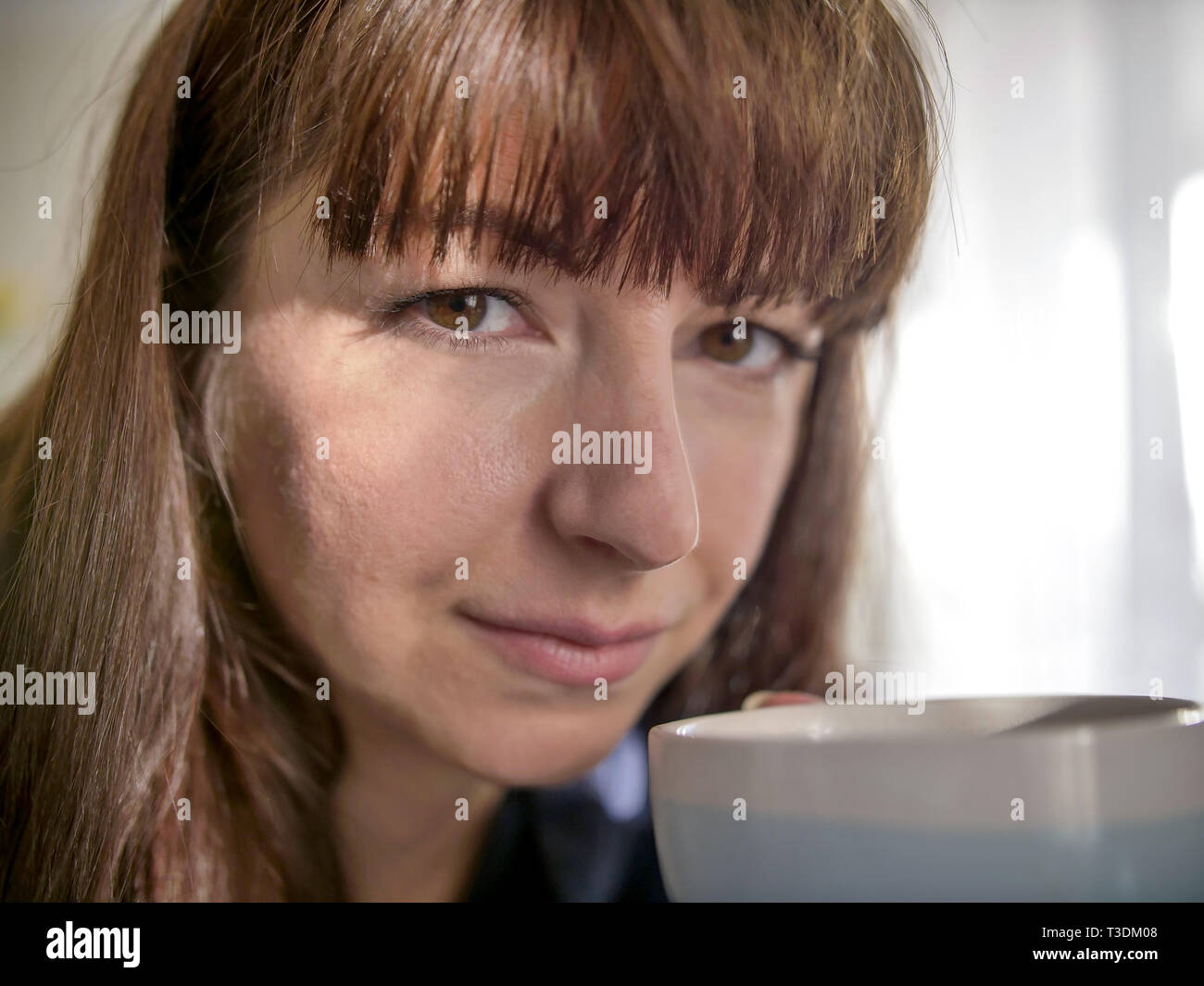 Portrait of a young woman, looking straight, close-up Stock Photo - Alamy