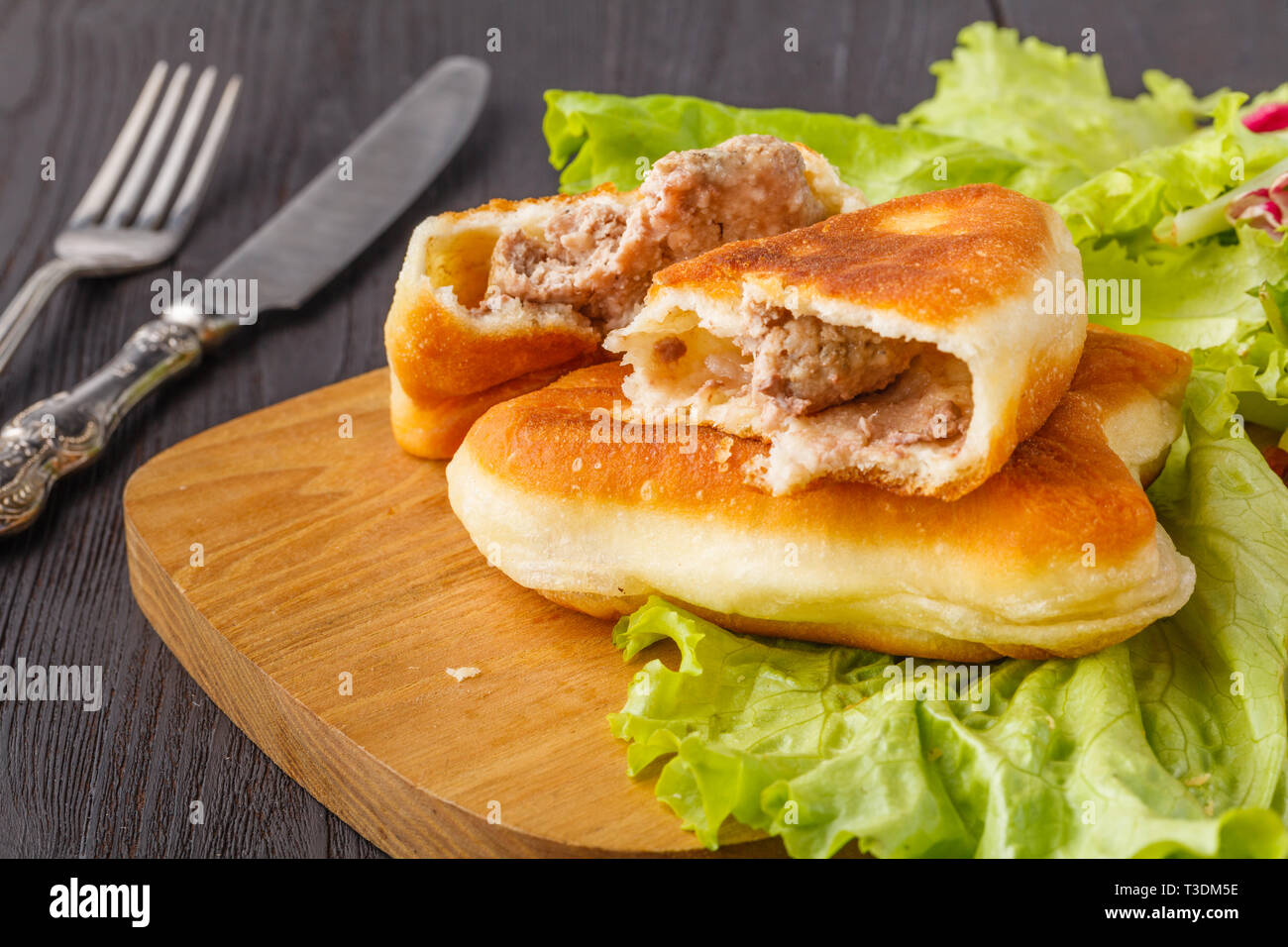 Savory stuffed patties on an wooden table. Country house style Stock ...