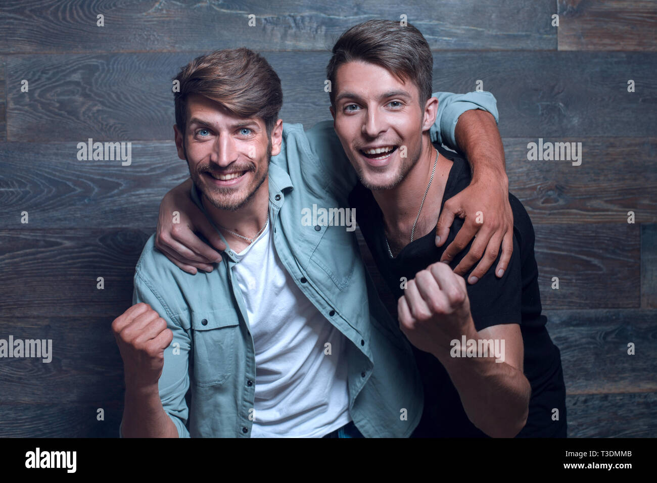 Two cheerful young students handsome hi-res stock photography and ...