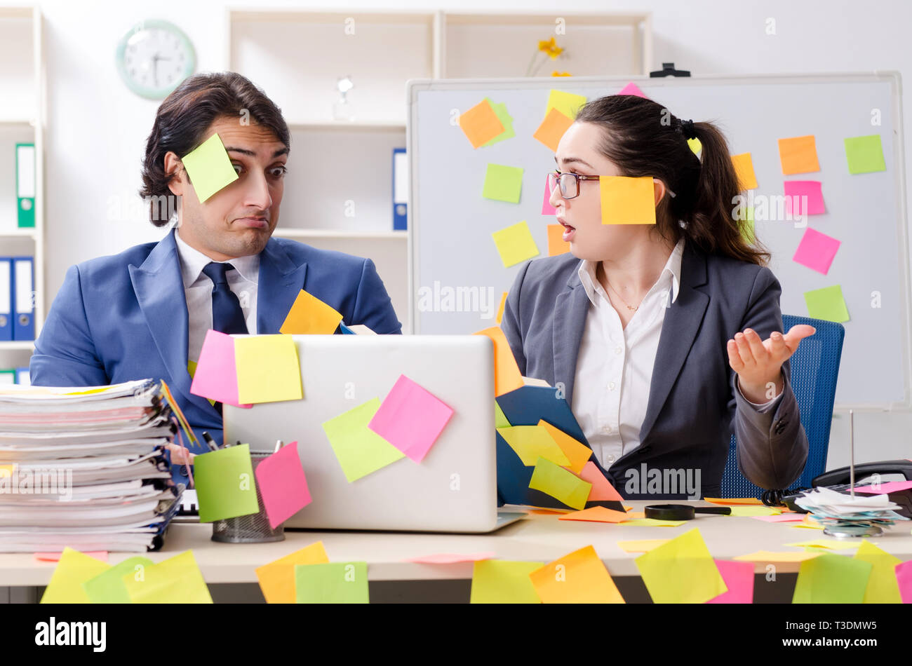 Two colleagues employees working in the office Stock Photo - Alamy