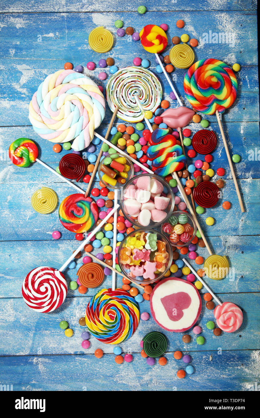 candies with jelly and sugar. colorful array of different childs sweets ...