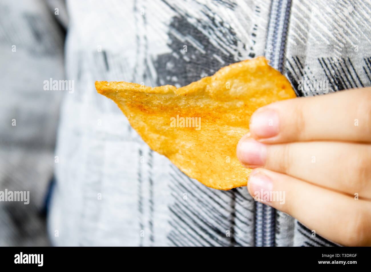 Eat chips boy hi-res stock photography and images - Alamy