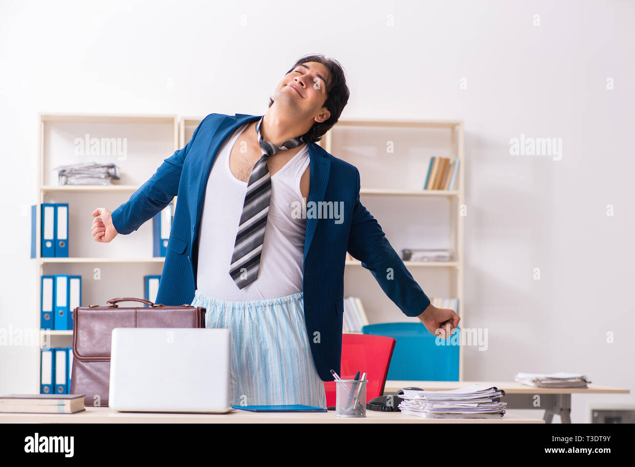 Employee coming to work straight from bed Stock Photo - Alamy