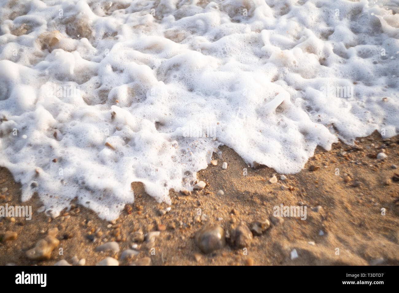 Tide coming in on a beach, close-up from above Stock Photo - Alamy