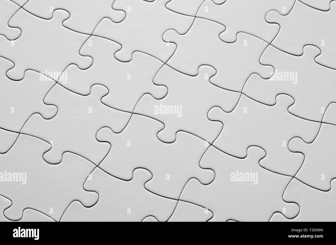 Combined puzzle pieces jigsaw pattern detail background Stock Photo - Alamy