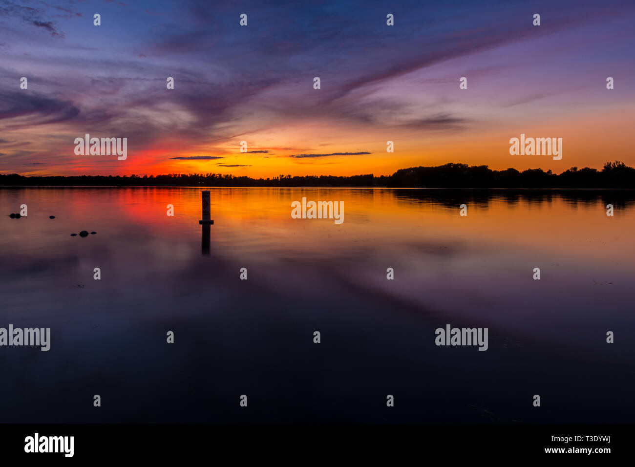 Cottage country lake sunset scene Stock Photo - Alamy
