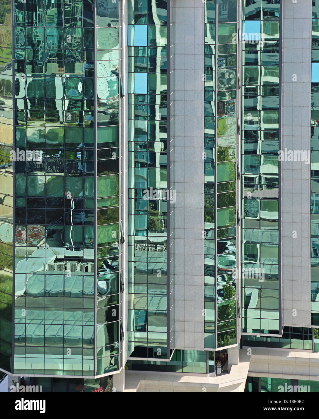 Modern Office Building With Green Glass Windows Stock Photo - Alamy