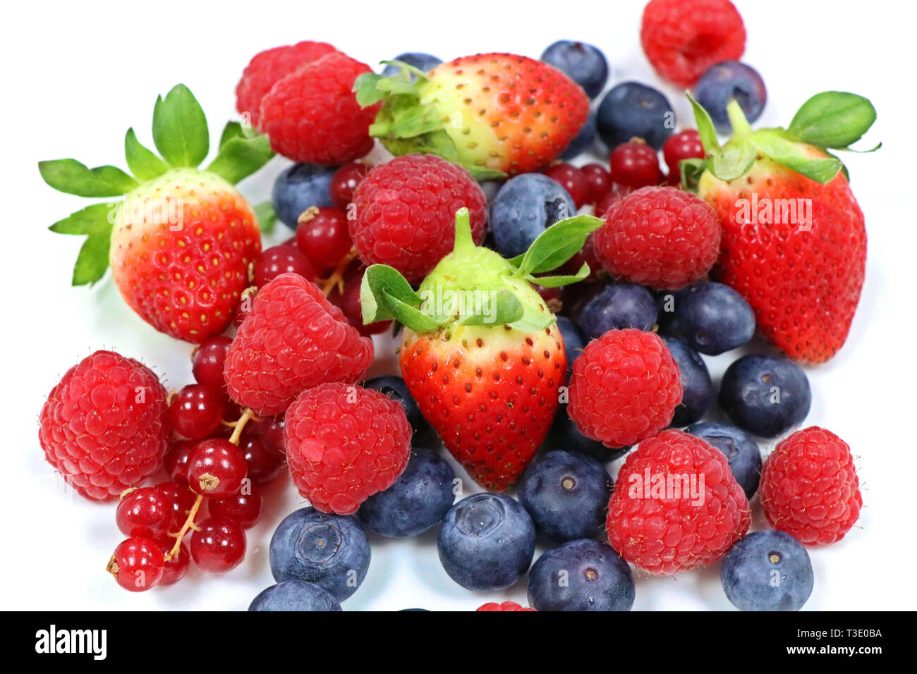 mix fresh berries isolated with white background Stock Photo - Alamy