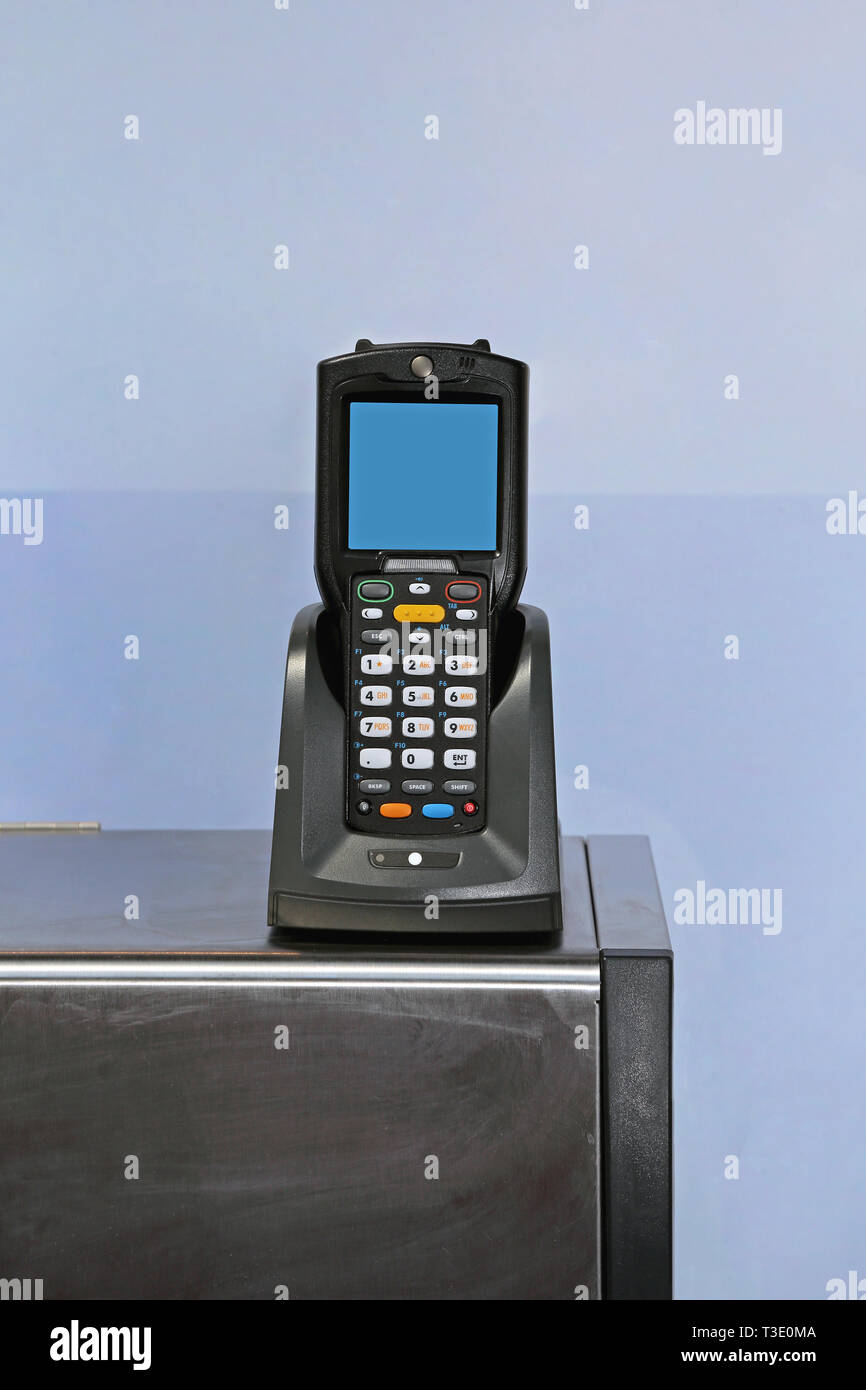 Handheld Laser Barcode Reader and Scanner at Charger Dock Stock Photo ...