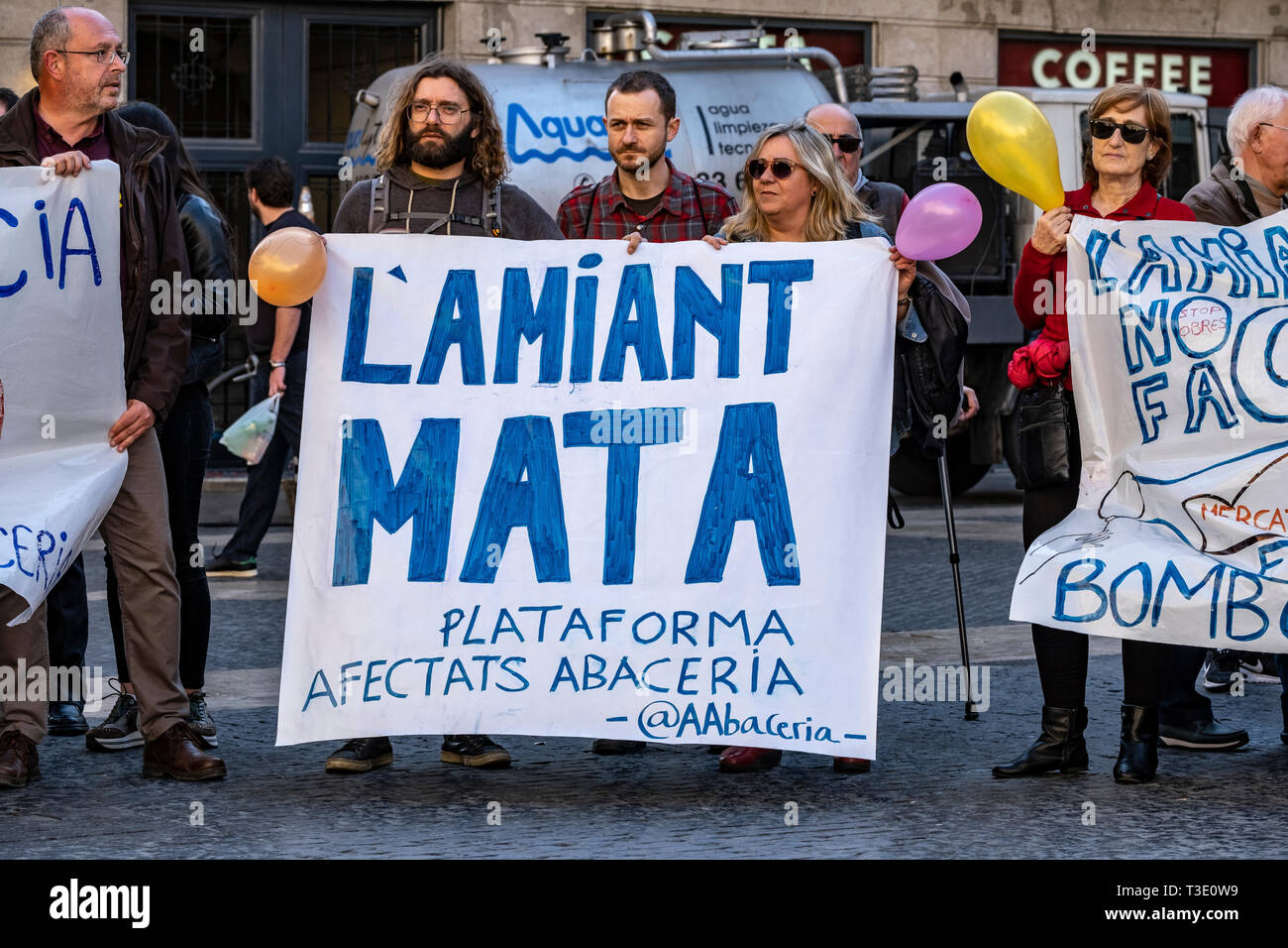 Demonstrators are seen holding a banner saying Asbestos kills during ...
