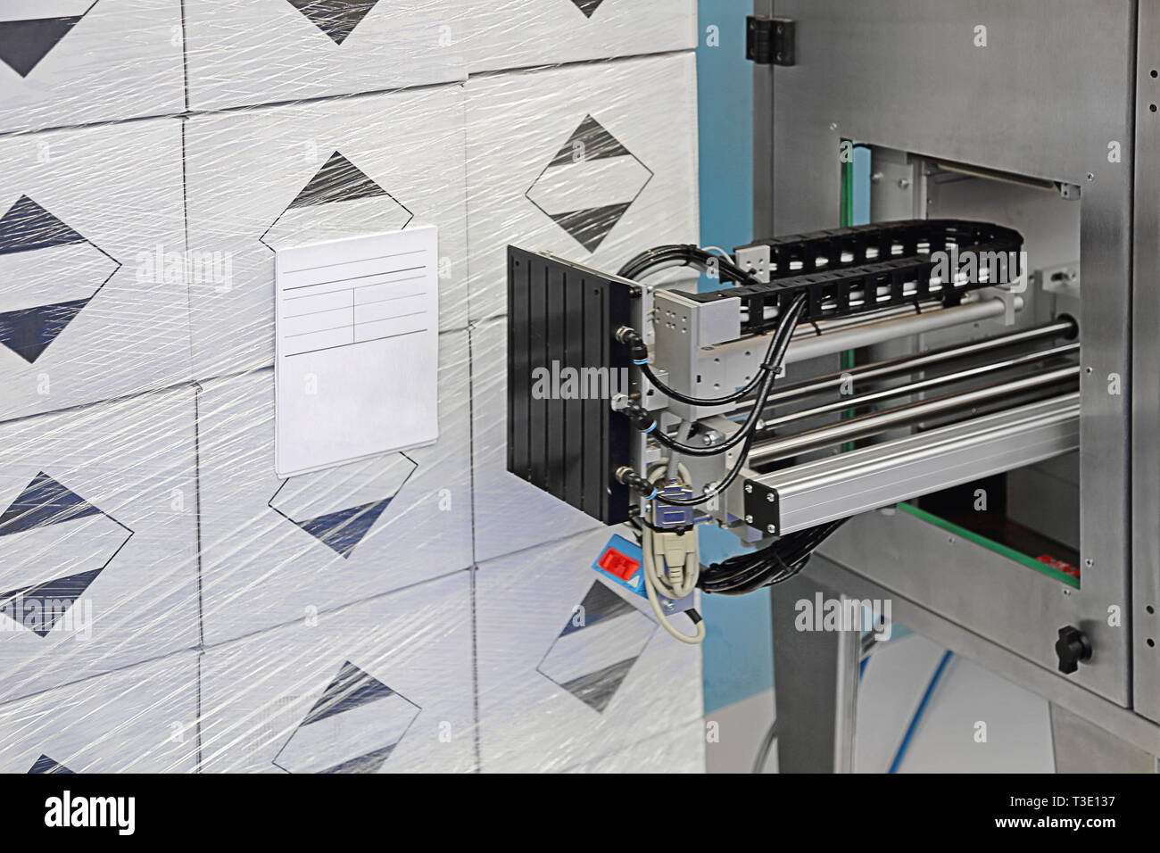Automated Pallet Labeling Machine in Factory Stock Photo - Alamy