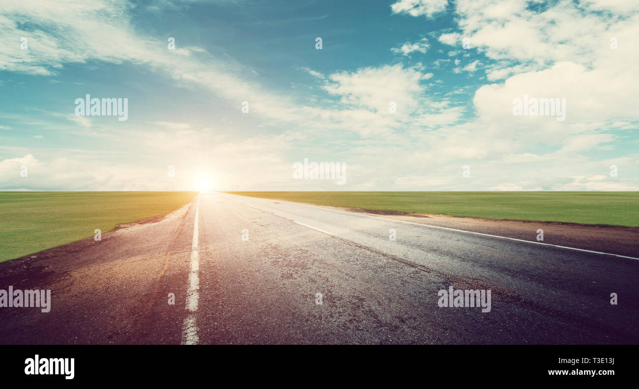 Panoramic road sunrise summer travel background Stock Photo - Alamy