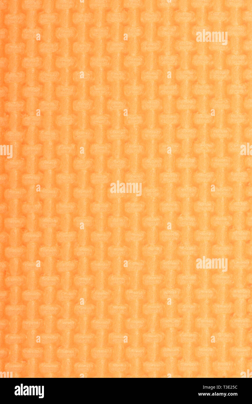 Texture of a polyethylene orange shine gym mat. Yoga mat texture ...