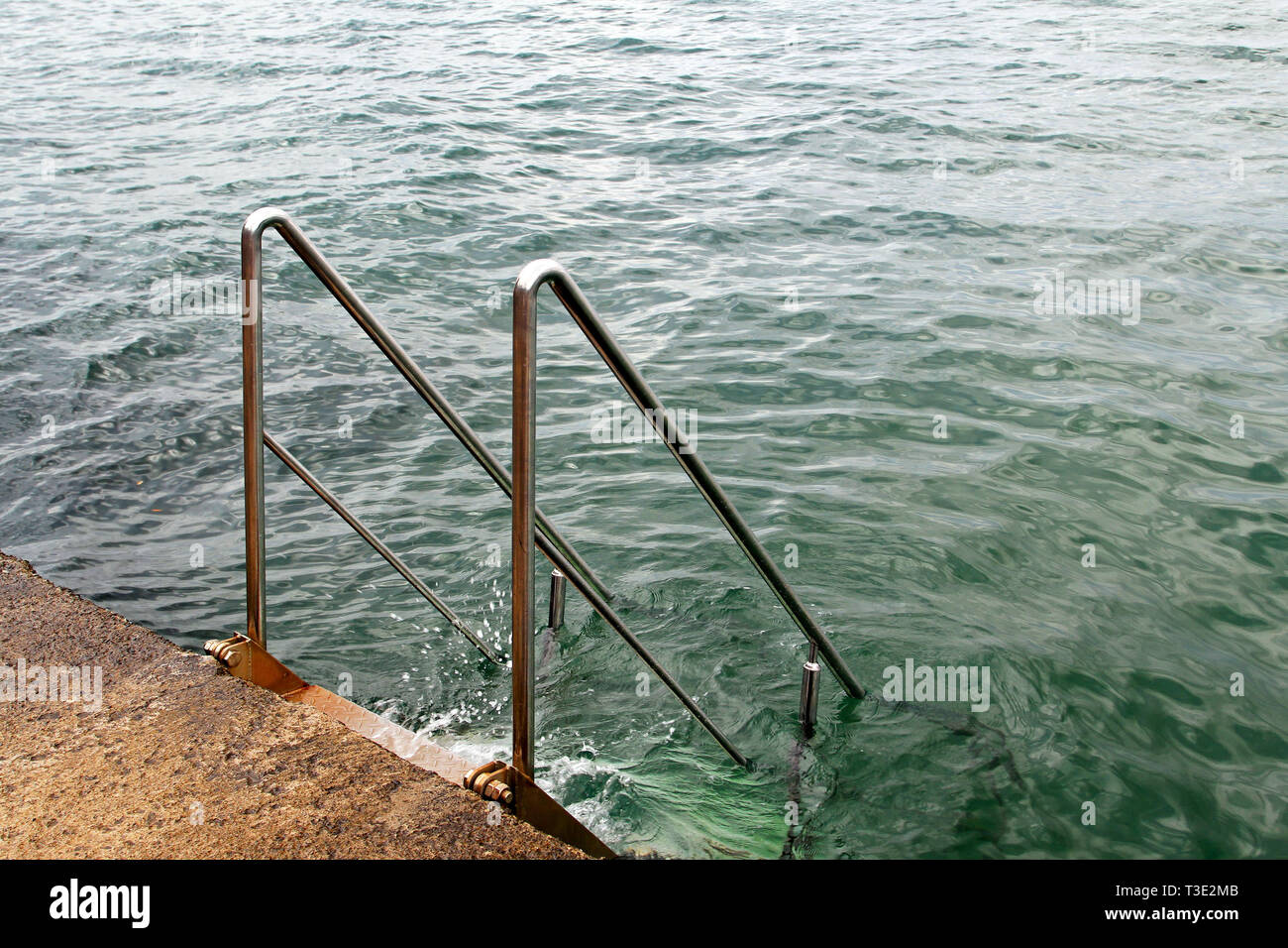 Metal stairway with handrail to the sea Stock Photo - Alamy