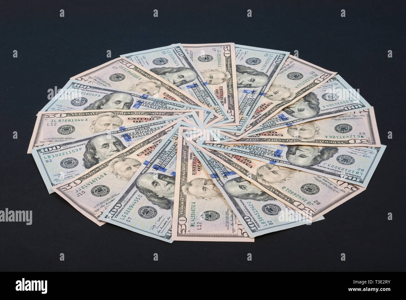 Money in the shape of a circle isolated on black background Stock Photo ...
