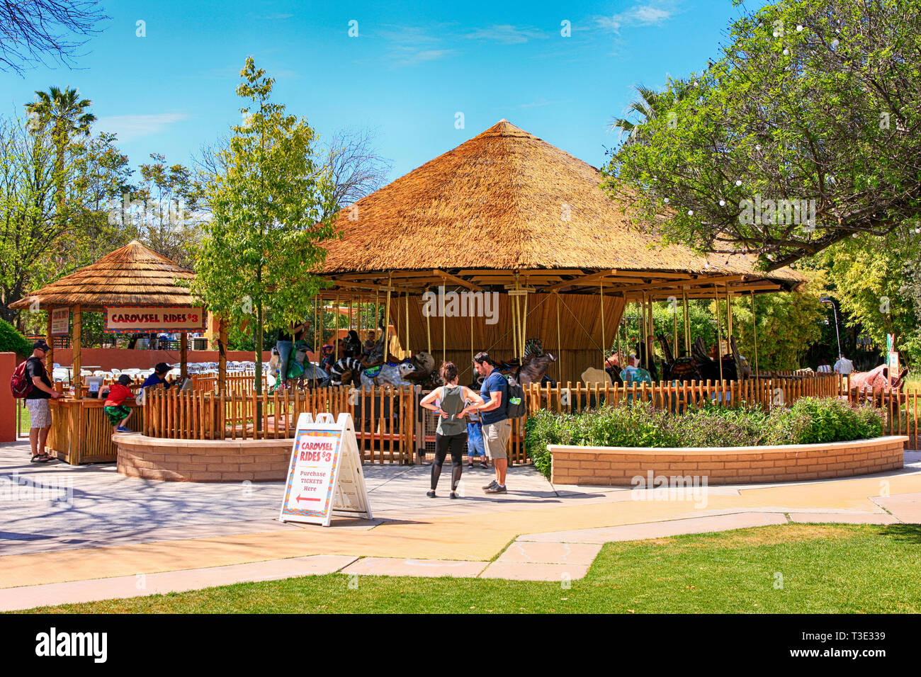 People having fun on the Wildlife Carousel at Reid Park Zoo in Tucson AZ Stock Photo - Alamy