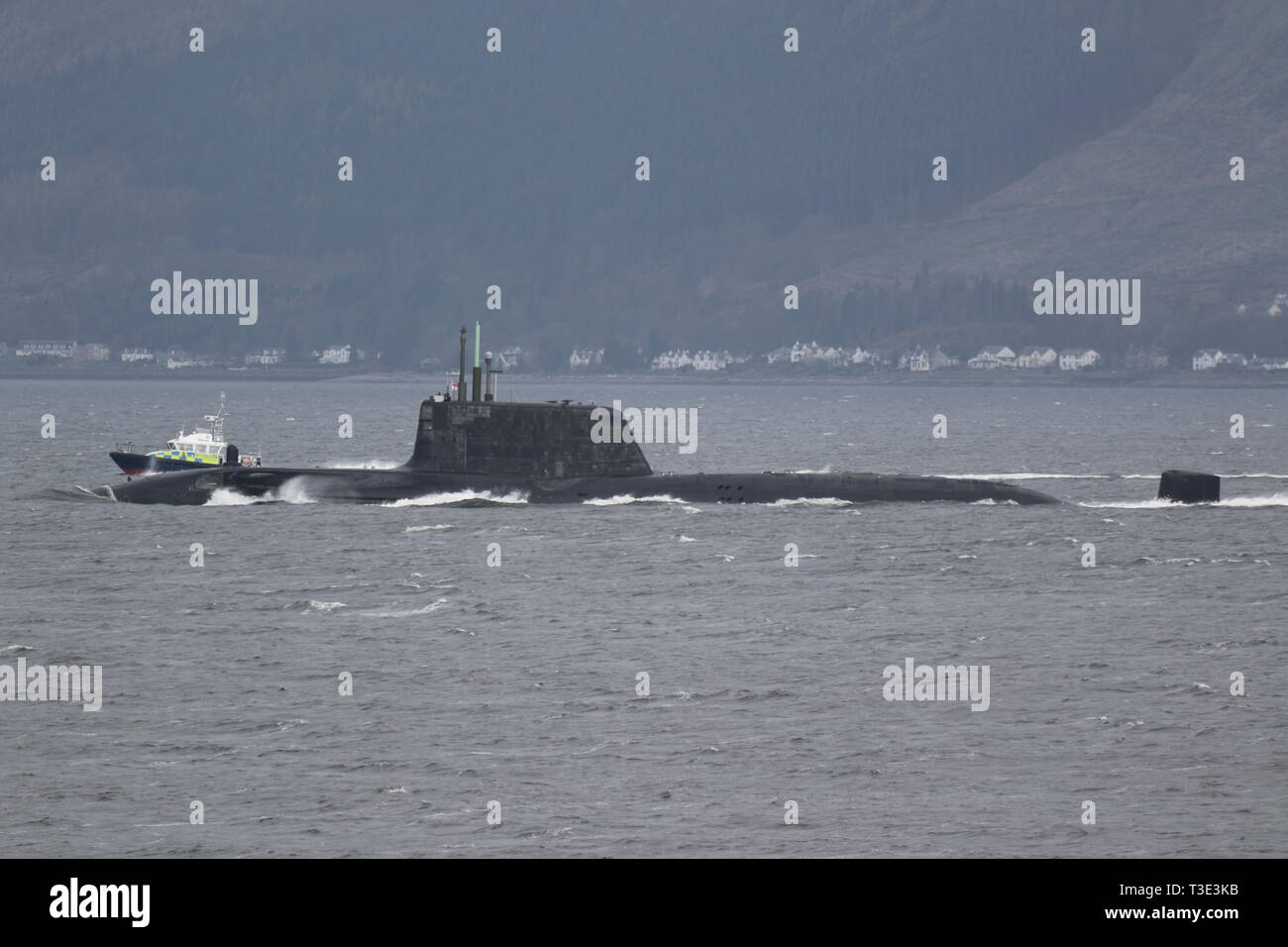 The Royal Navy's attack submarine HMS Ambush (S120), being escorted ...