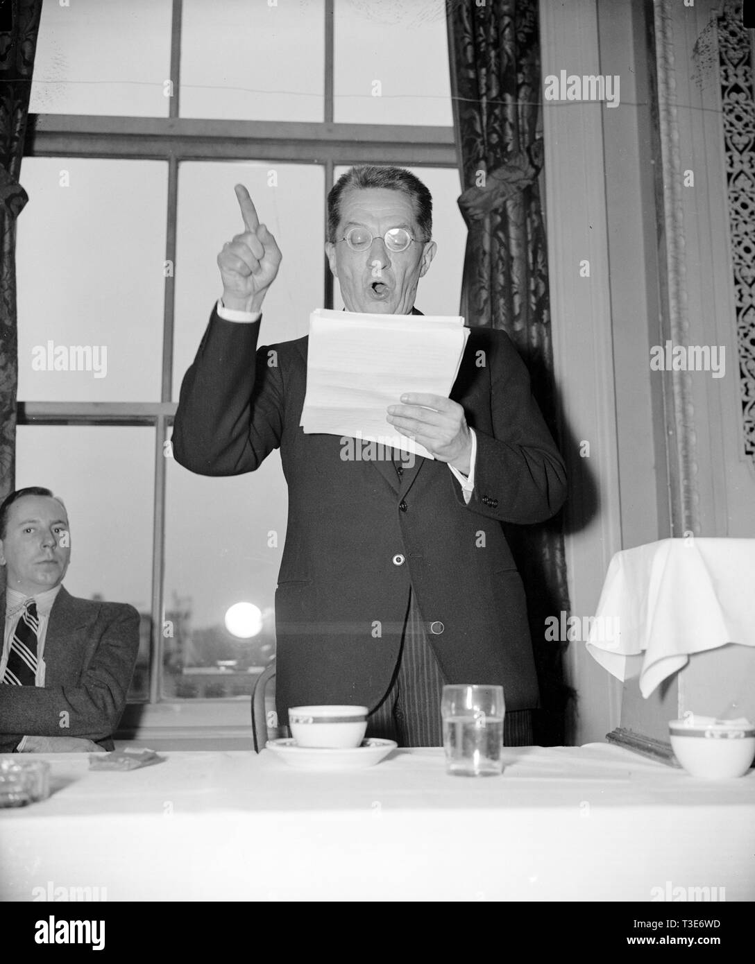 Man reading from written speech in 1930s, pointing as he speaks Stock ...